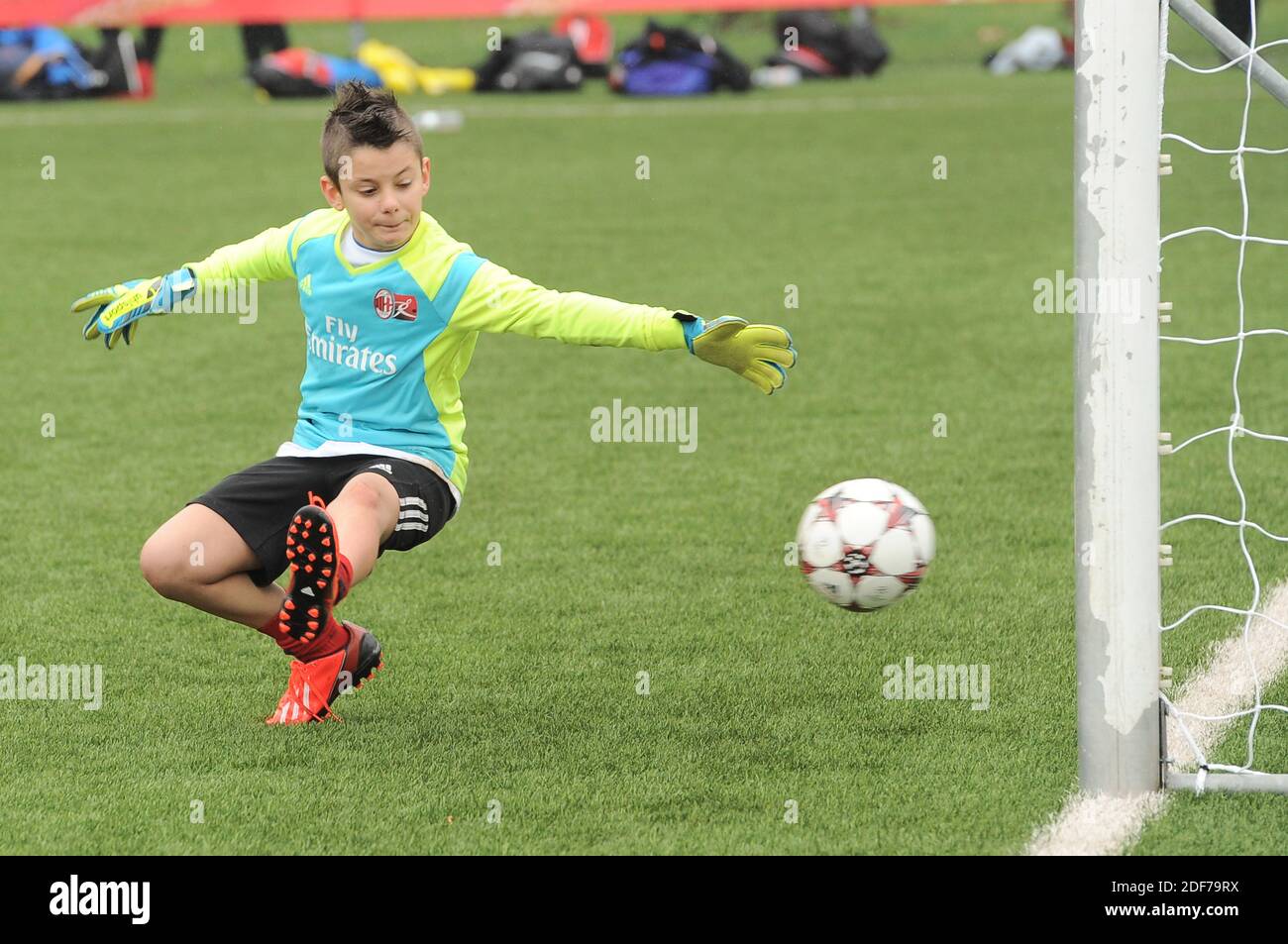 Kids' soccer, children play ball in football school Stock Photo - Alamy