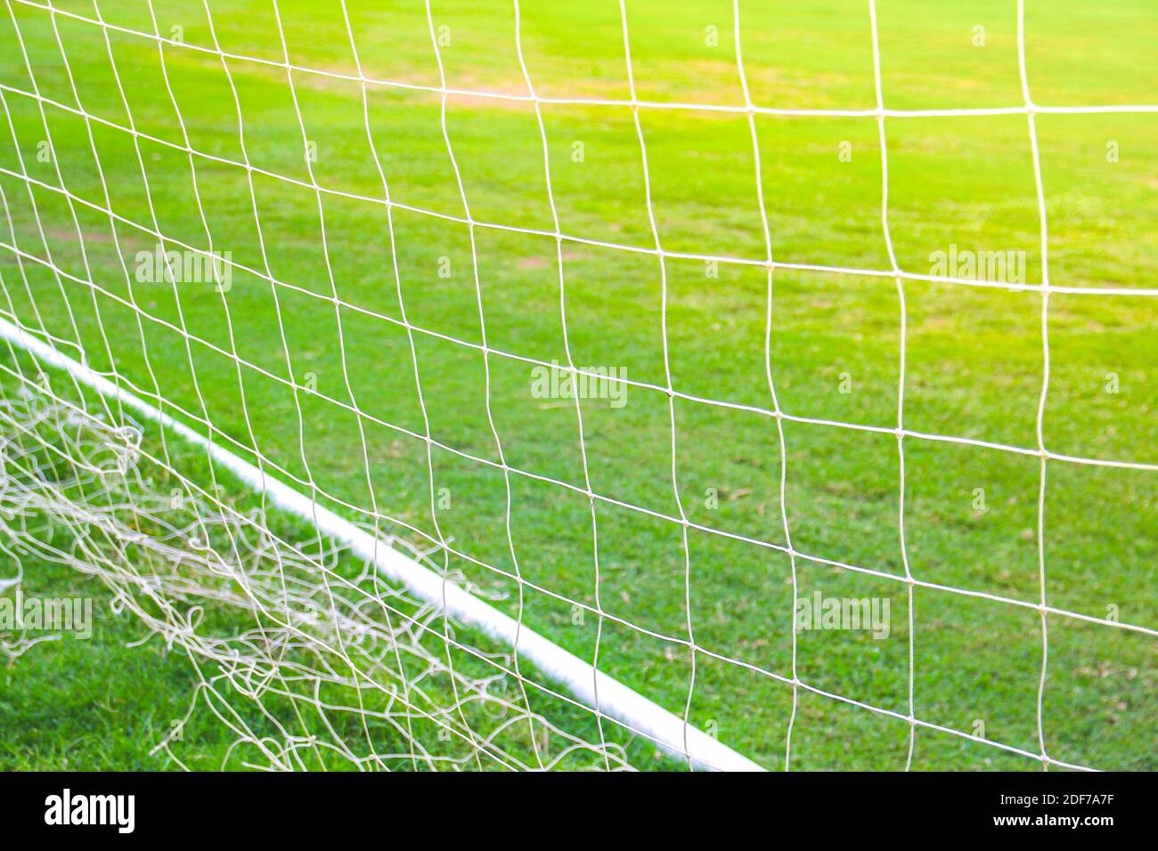 Close up of football soccer goal net with green grass Stock Photo - Alamy
