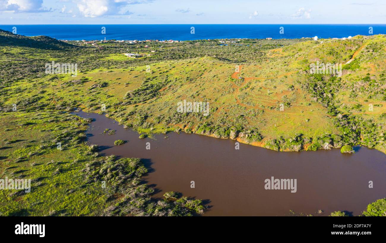 Aerial scenery over hills and lake above Caribbean Island of Curacao ...