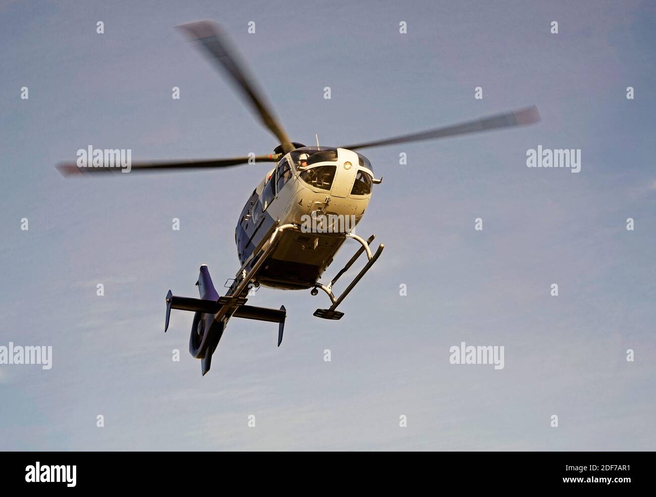 A Eurocopter EC130 air ambulance takes off from a helicopter landing ...