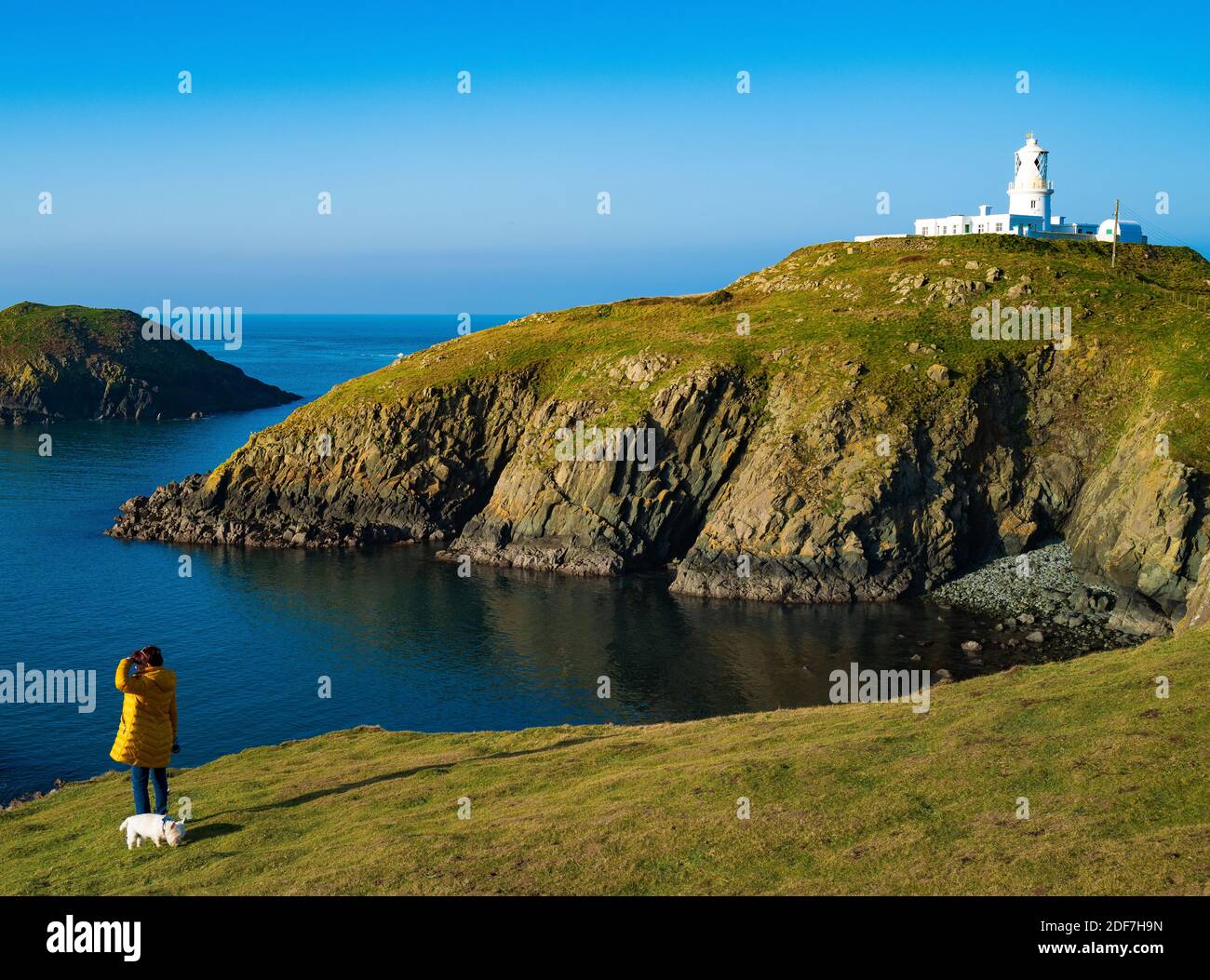 Strumble Head Lighthouse. Tourist looking out to sea. Winter Sunshine ...