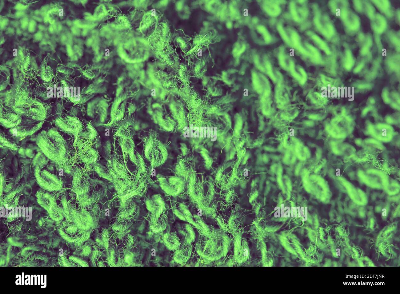 Defocused fluffy wool texture on blur background, abstract green color ...