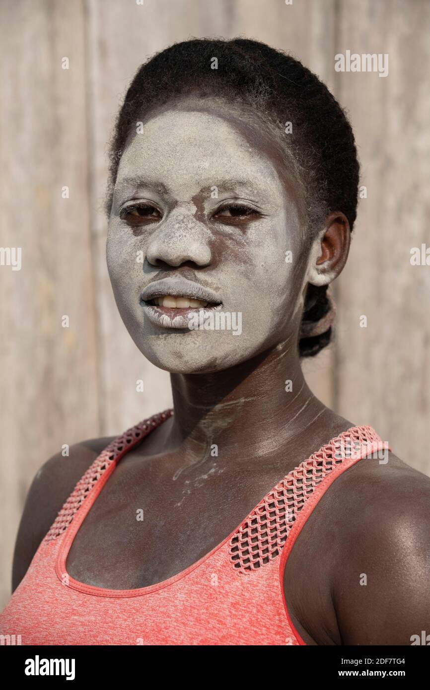 Gabon, Libreville, portrait of a woman with kaolin traditional makeup ...