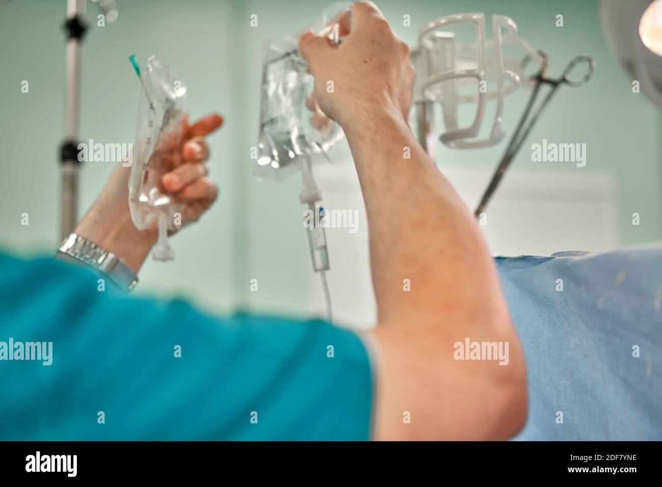 Surgeon Inserting Tube Into Patient During Surgery Stock Photo - Alamy