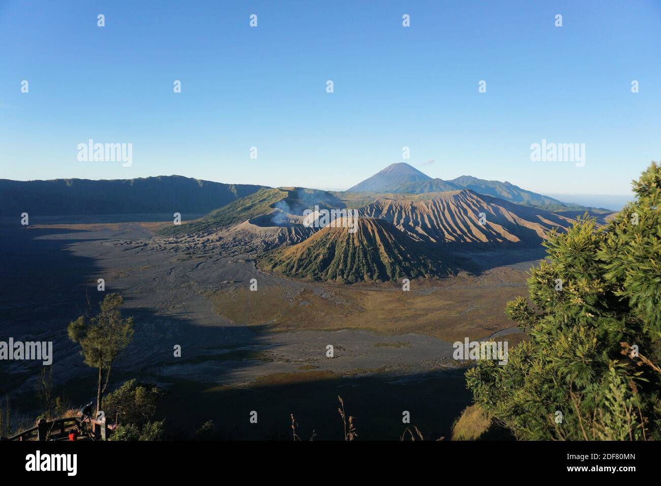 View of Caldera Tengger with volcanoes at sunrise, smoking volcano ...