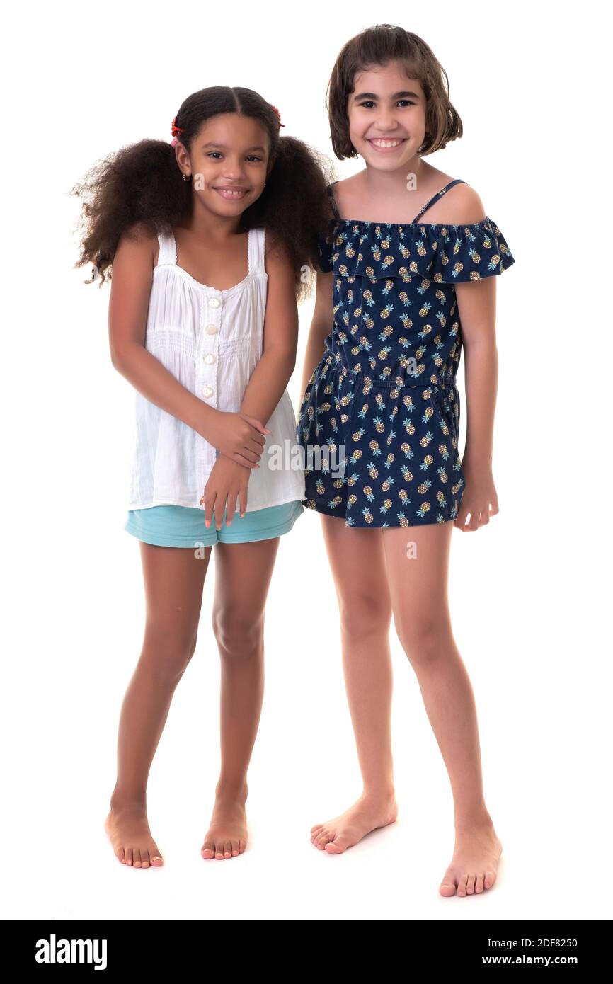 Two friendly small girls, friends or sisters - Hispanic and african ...
