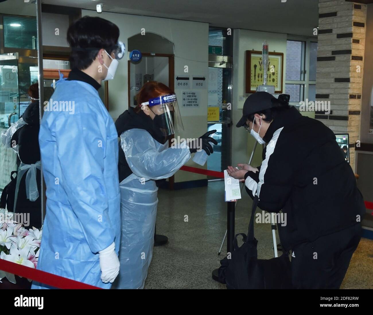 Seongnam, South Korea. 3rd Dec, 2020. An examinee gets his hands ...