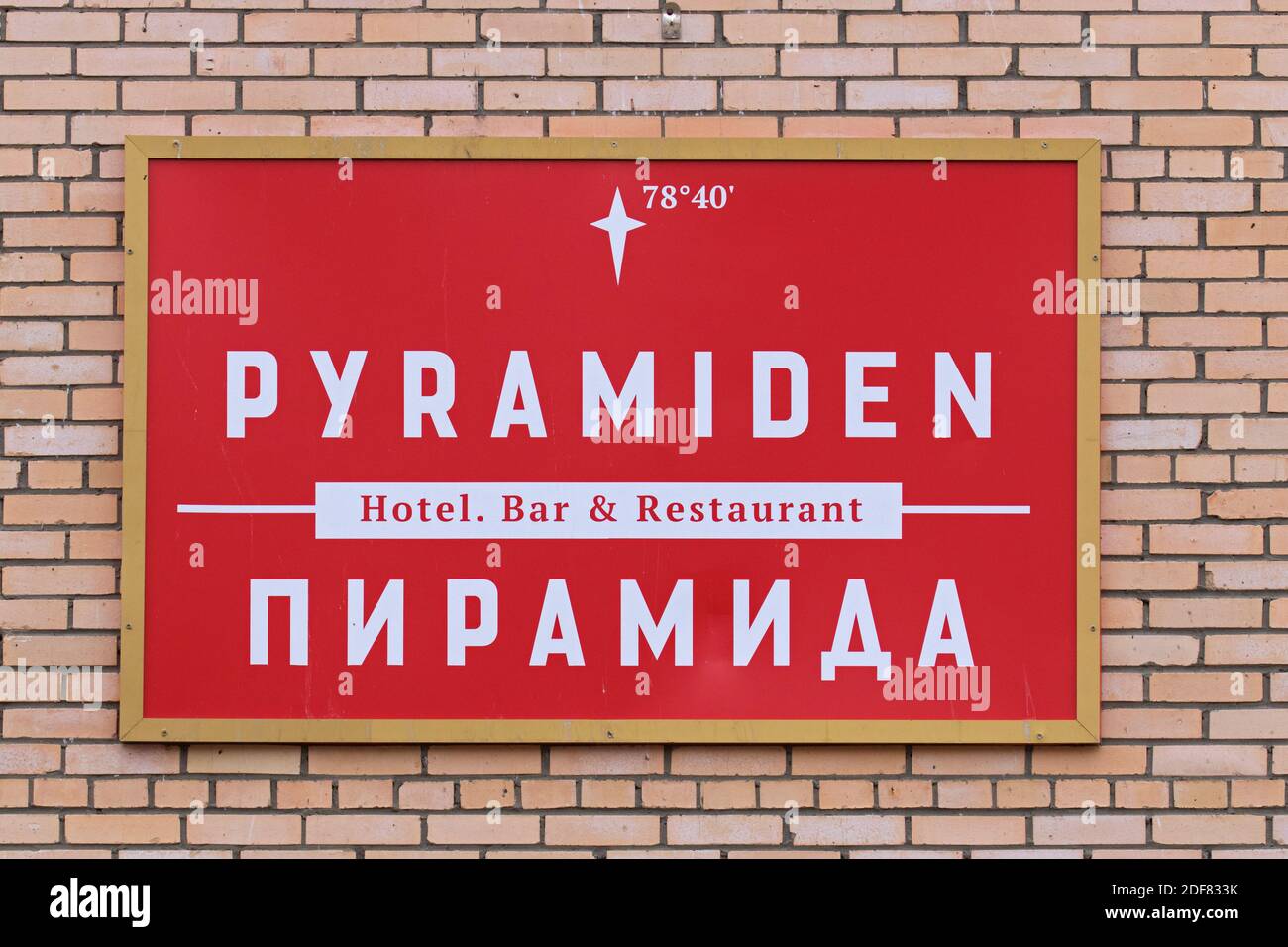 Red sign on wall of hotel bar restaurant at Pyramiden, abandoned Soviet ...