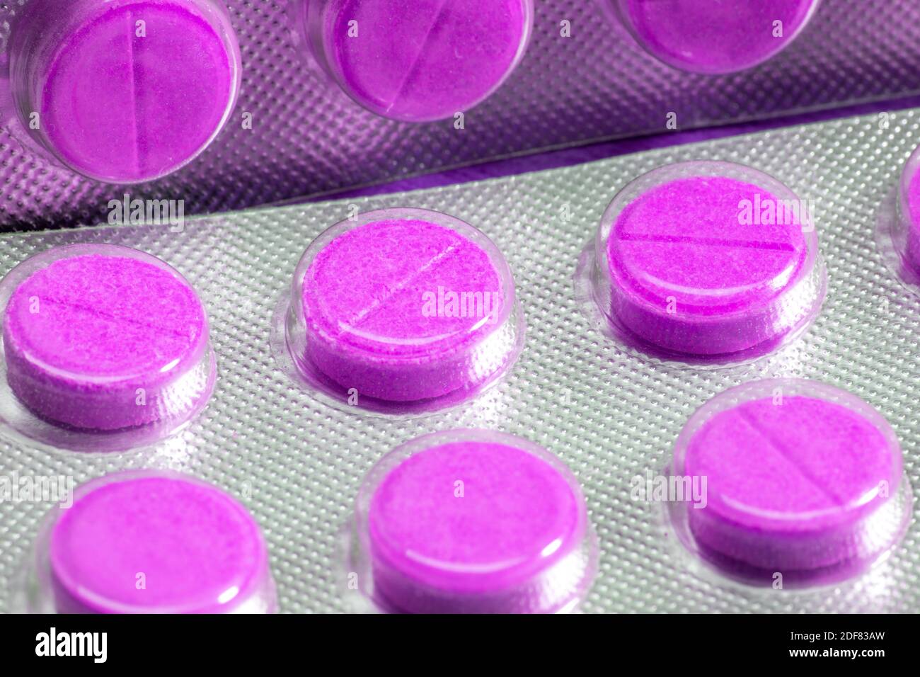 purple tablets in a close-up blister Stock Photo - Alamy