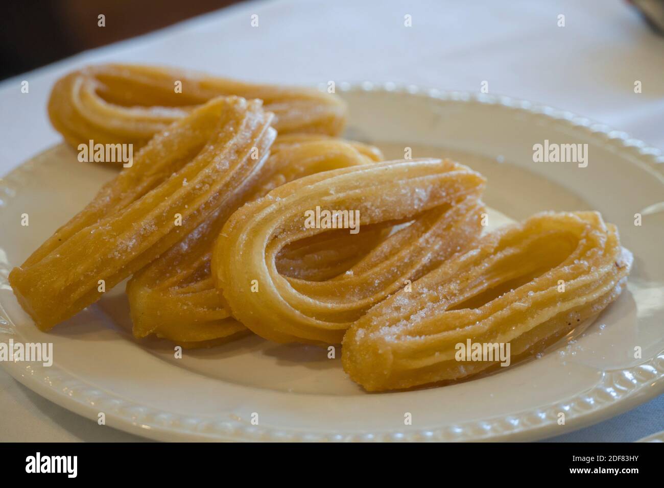 Spanish breakfast with churros and coffee Stock Photo - Alamy