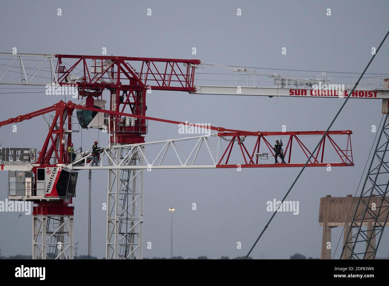Oct. 2, 2020, Austin TX USA: A crew of specialists work with a luffing ...