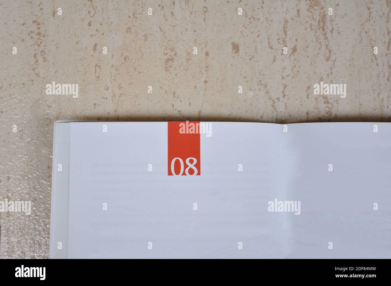 Number eight, number printed in white color with red background on ...