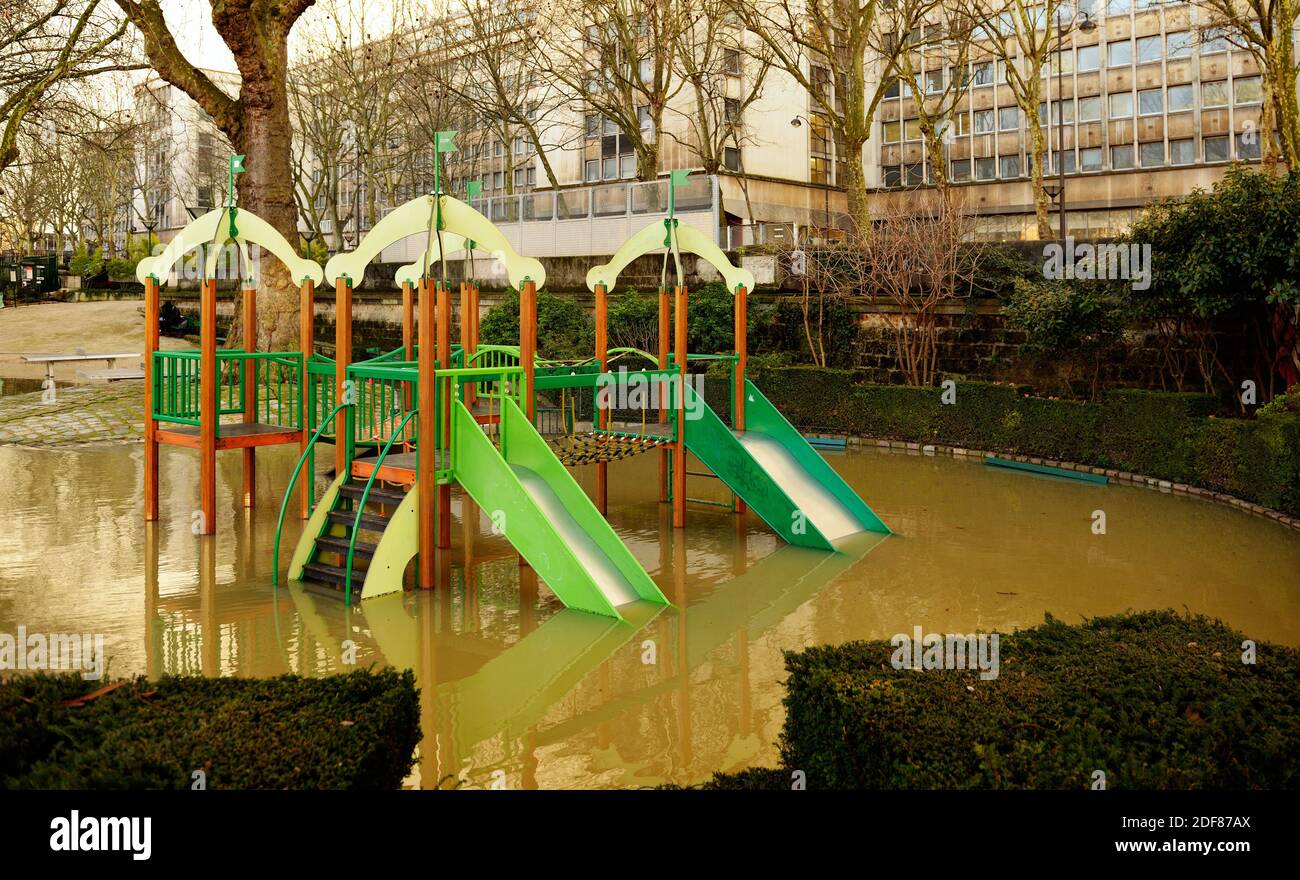 Immersed public park with children playground. Seine river water ...