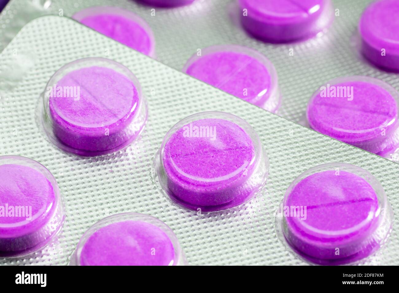purple tablets in a close-up blister Stock Photo - Alamy
