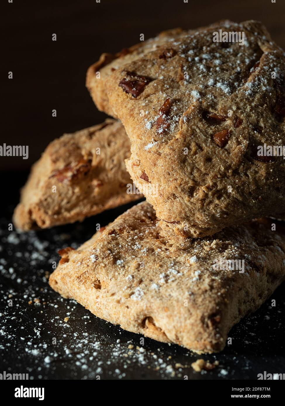 Three sweet bread cakes on a black background, typical sweet in some ...