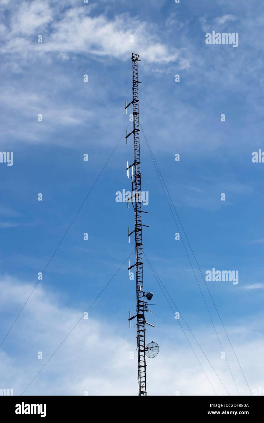 Tall radio communication mast or mobile tower with antennas and ...