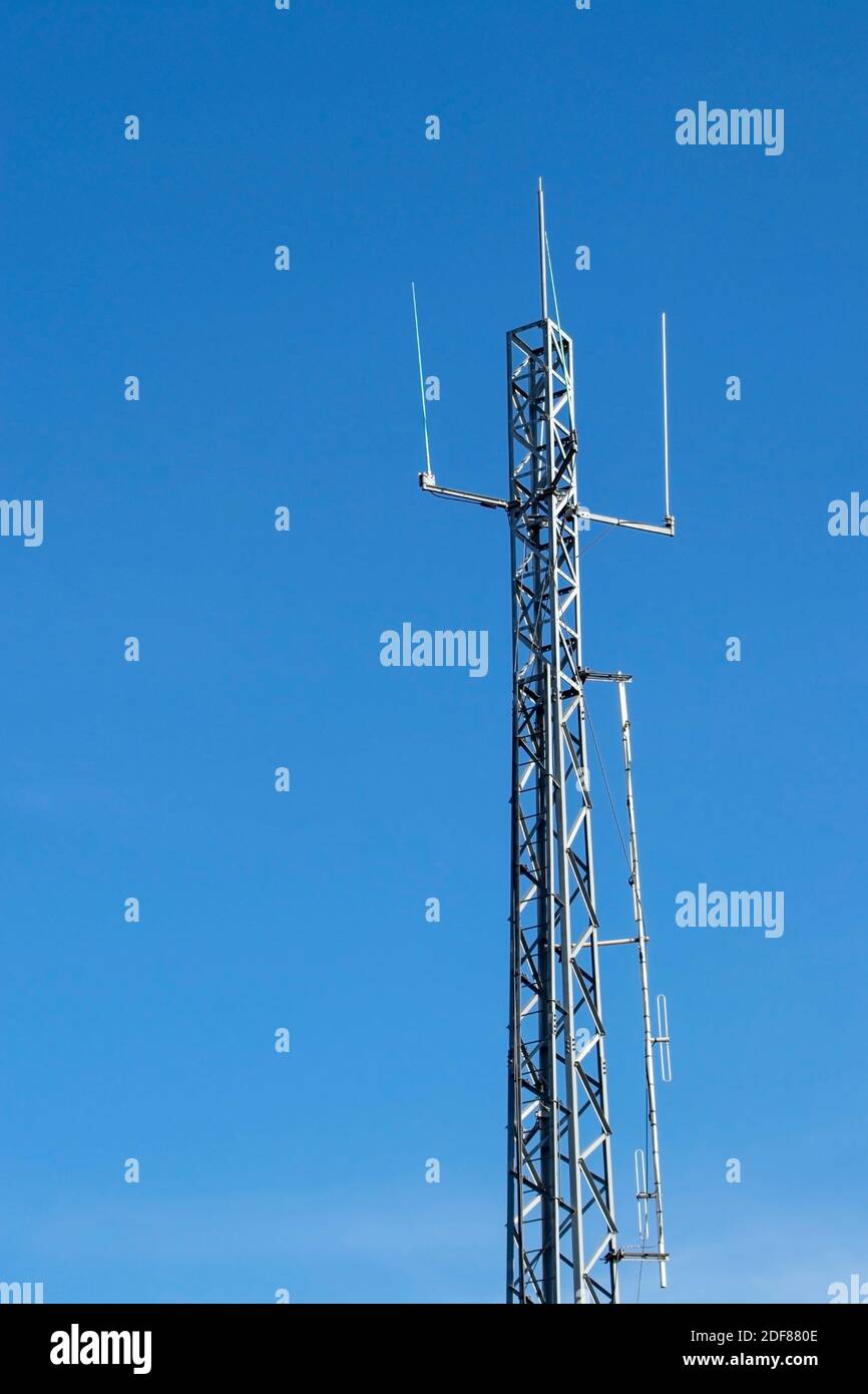Aerial antennas on the metallic mast. Communication equipment on the ...