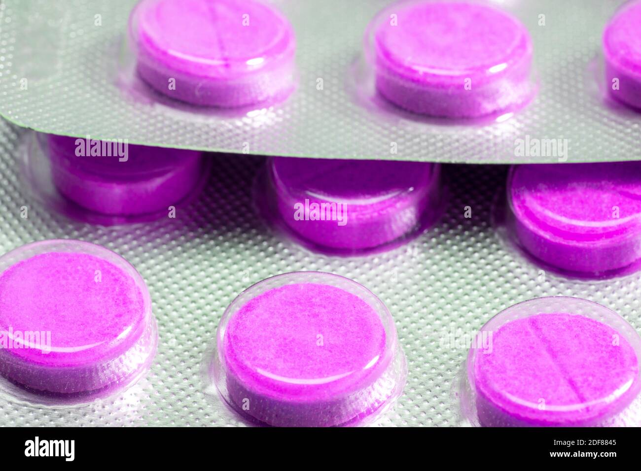 purple tablets in a close-up blister Stock Photo - Alamy