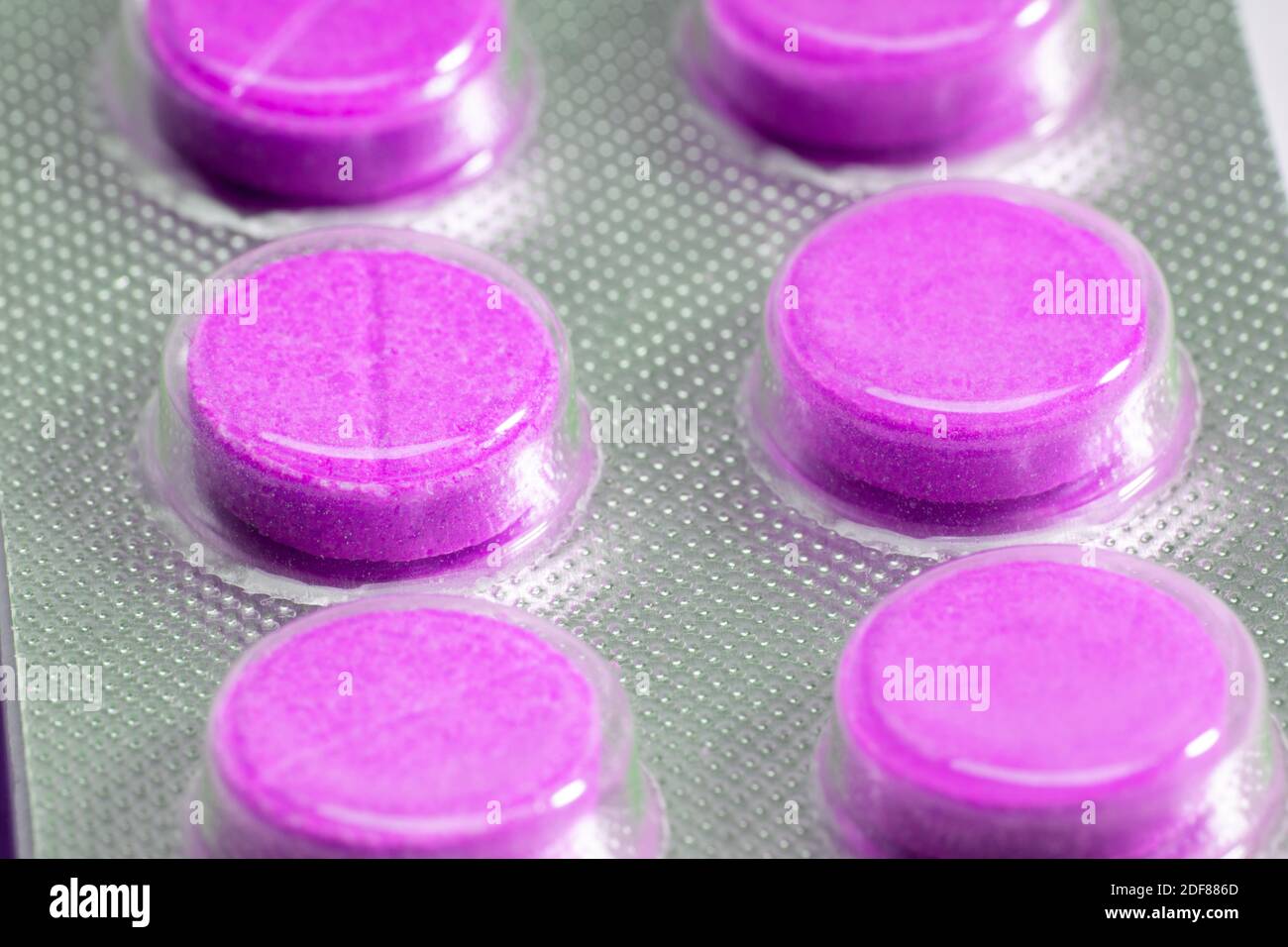 purple tablets in a close-up blister Stock Photo - Alamy