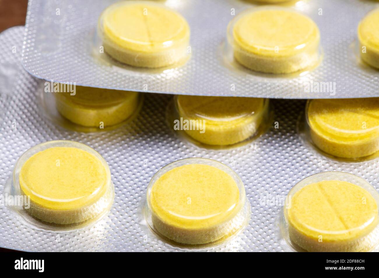 yellow tablets in a close-up blister Stock Photo - Alamy