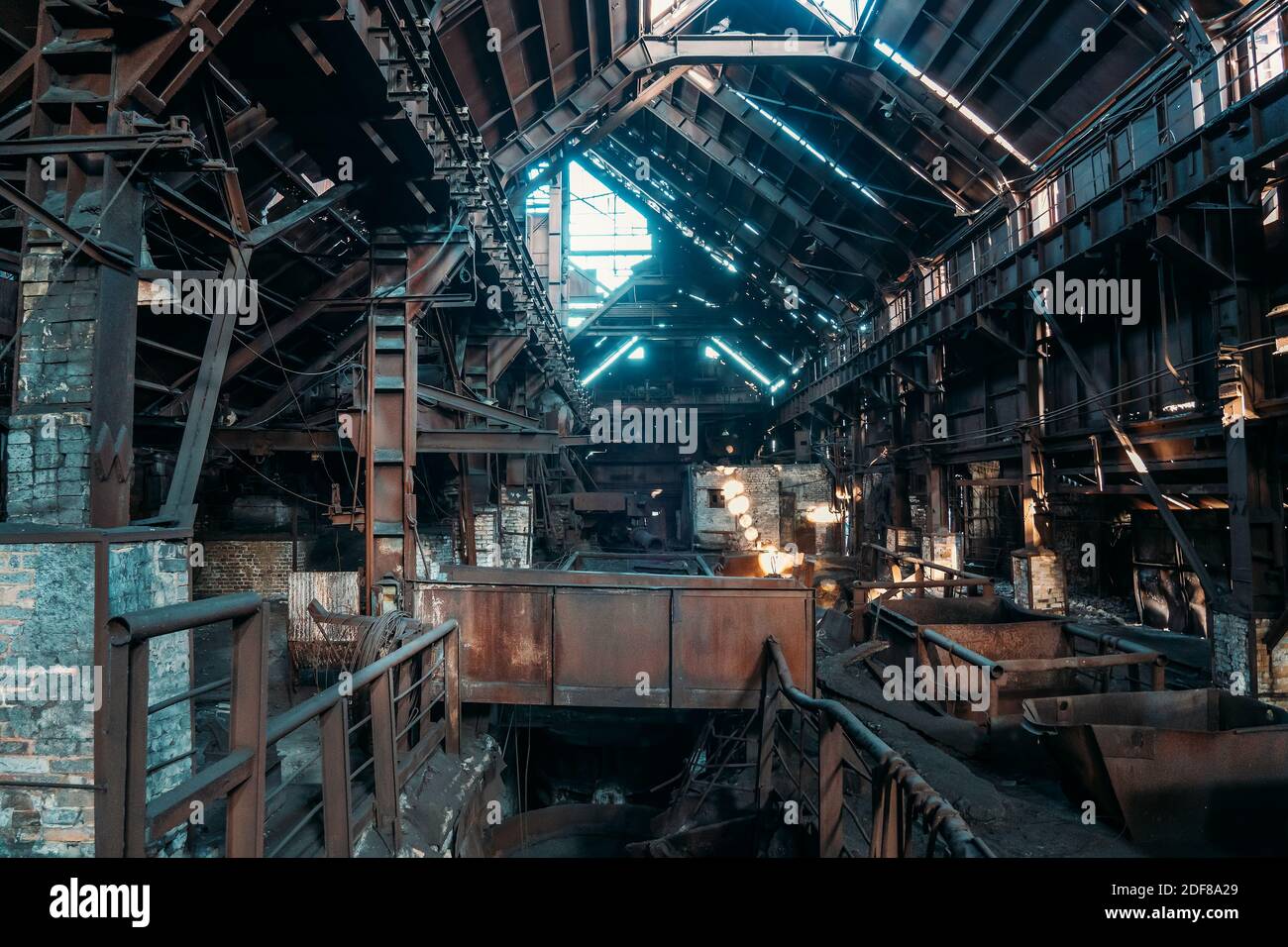 Large hangar or workshop of old rusty industrial metallurgical plant ...