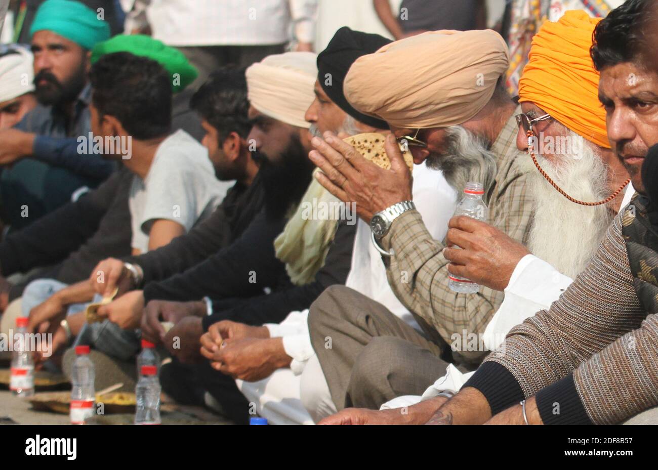 Sikh farmer praying to God after getting a prasad during the ...
