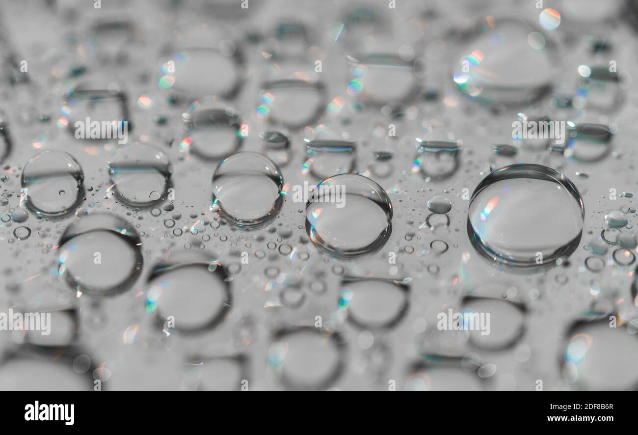 Macro photography of water drops on a mirror reflective surface Stock ...