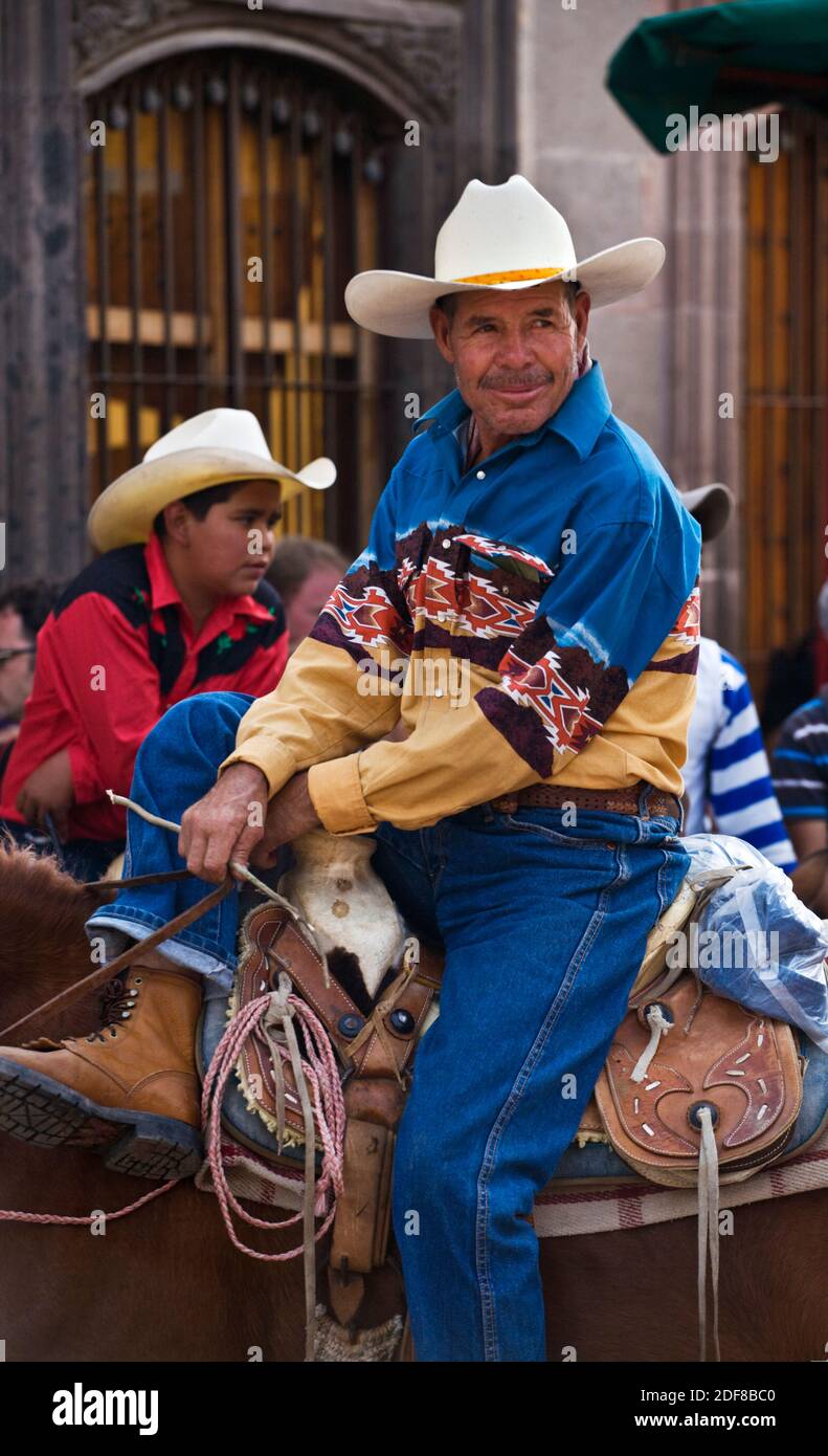 CABALLEROS or MEXICAN COWBOYS ride into town to start the annual ...