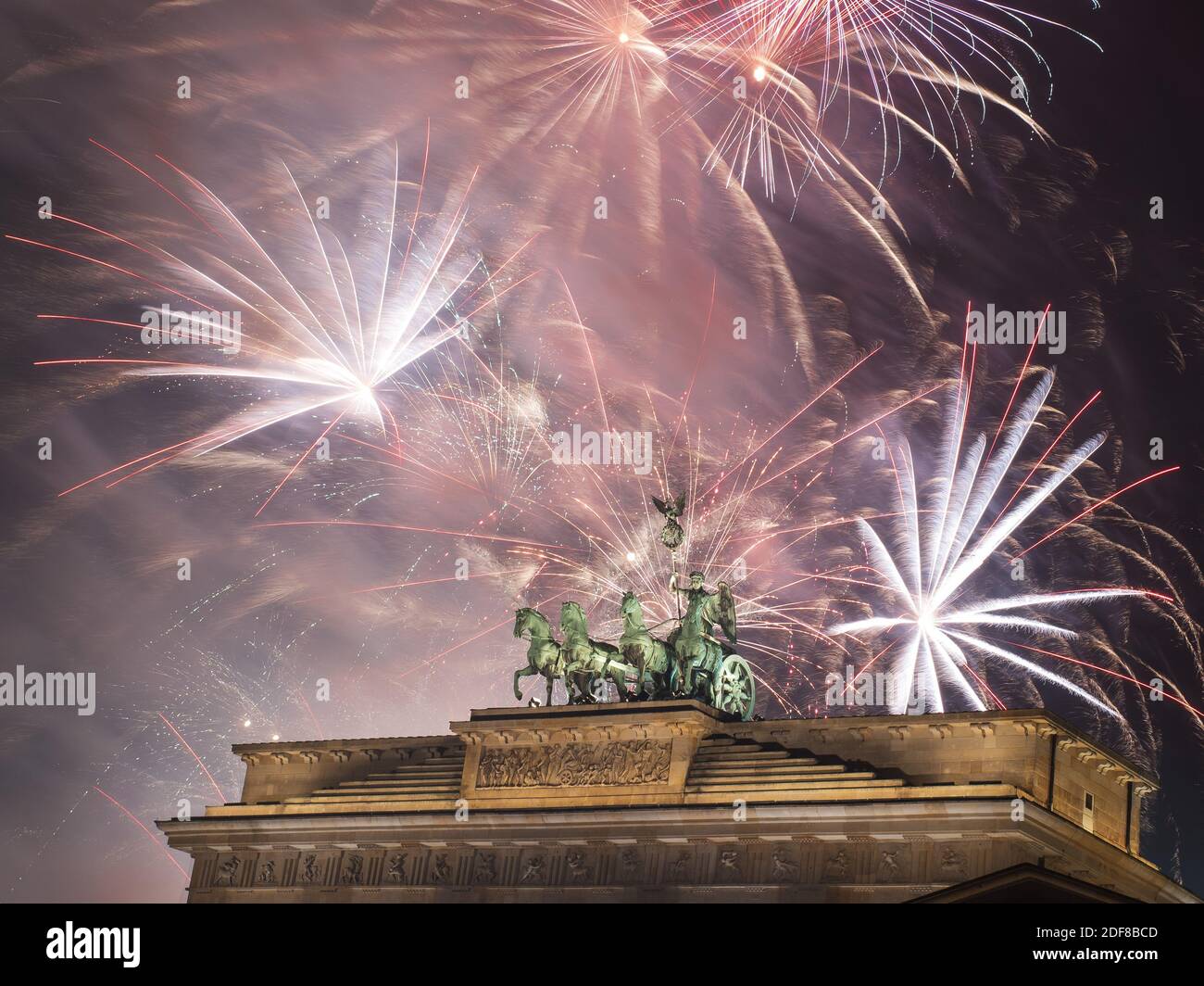 Fireworks over the Brandenburg Gate in Berlin, Germany, during New Year ...