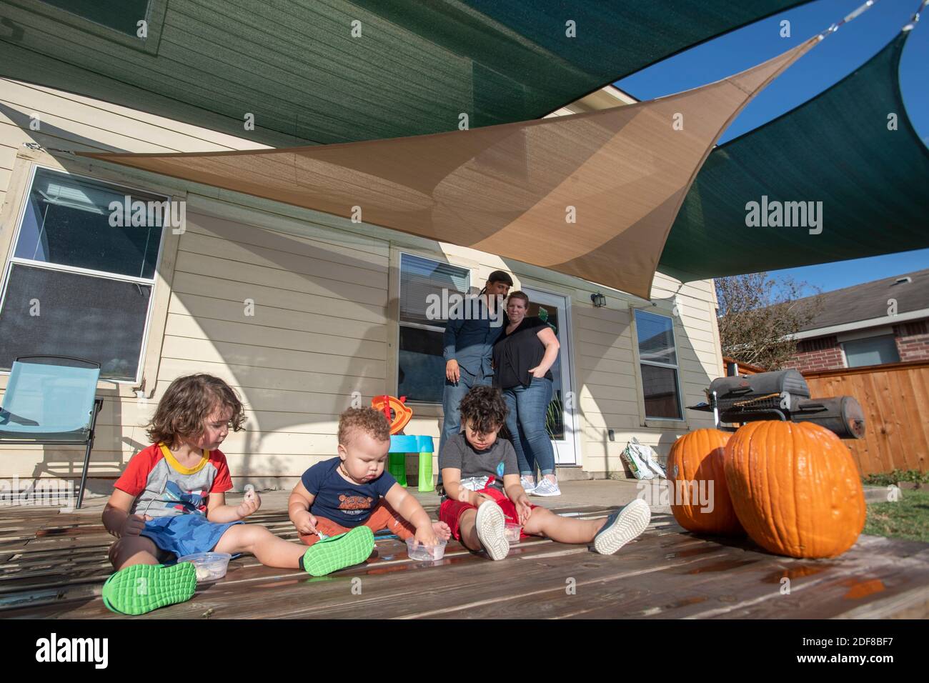 Nicole and Brandon Overton watch their three youngest children Greeley ...