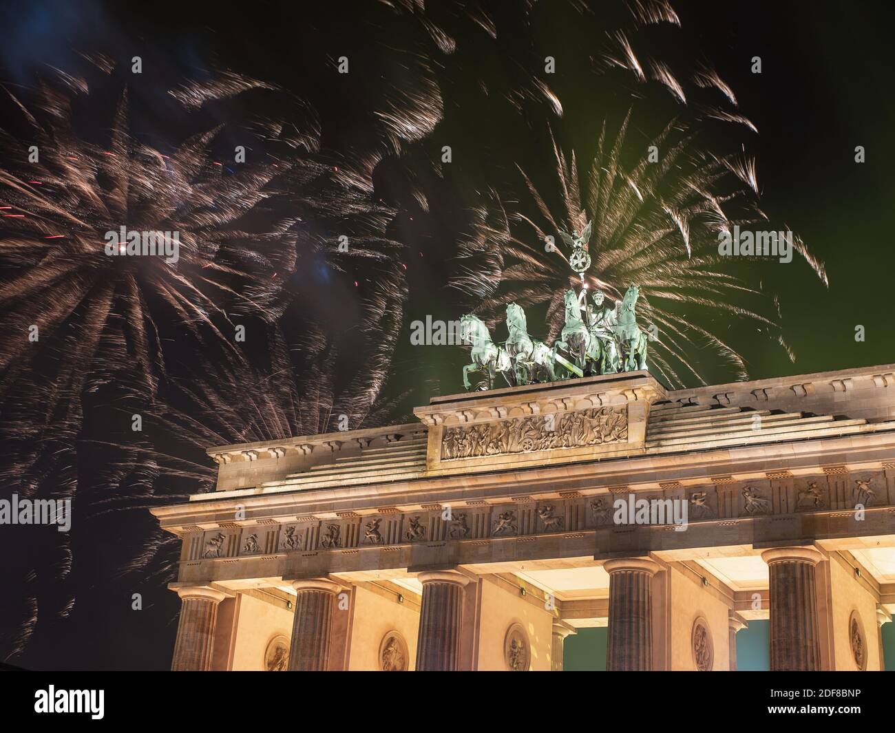 Fireworks over the Brandenburg Gate in Berlin, Germany, during New Year ...