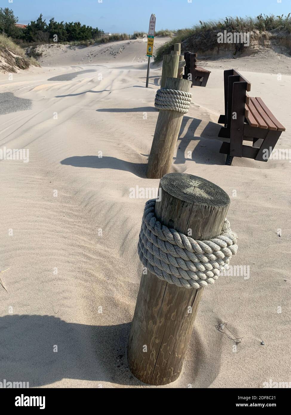 Bench and wooden posts at a beach Stock Photo - Alamy