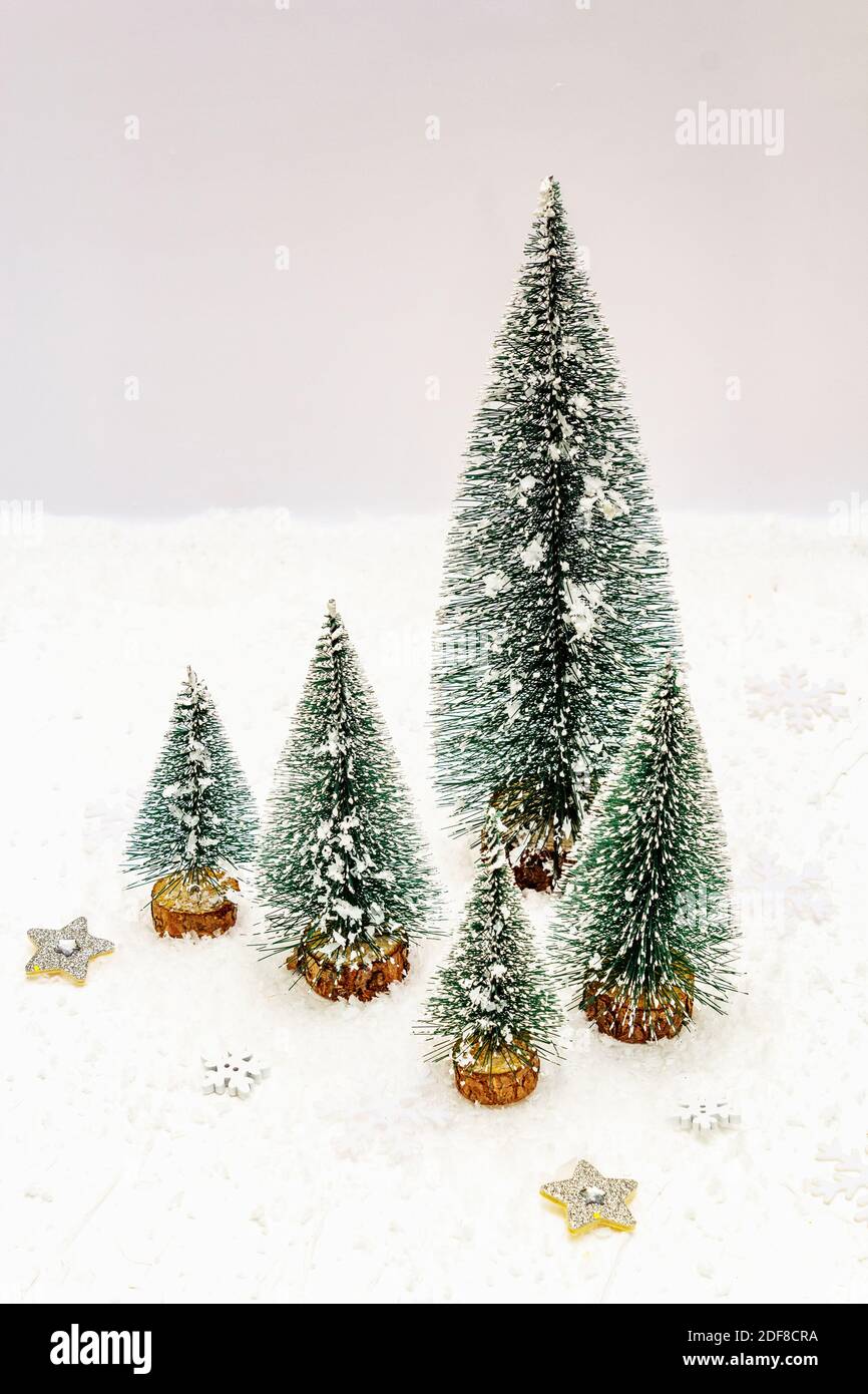 Small decorative Christmas trees with New Year's decor. Snowflakes ...