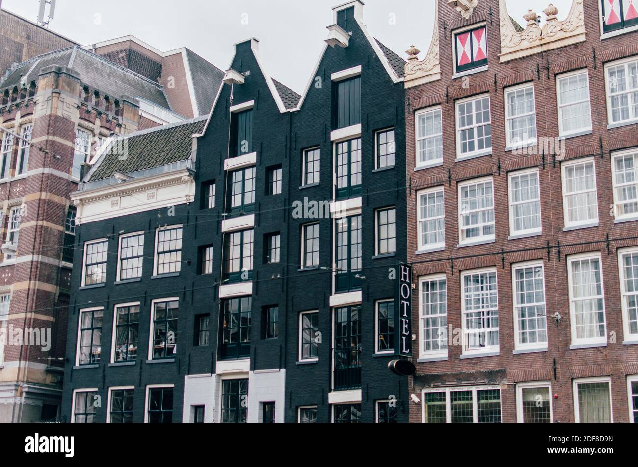 Classic dutch buildings and hotel in Amsterdam, The Netherlands, build ...