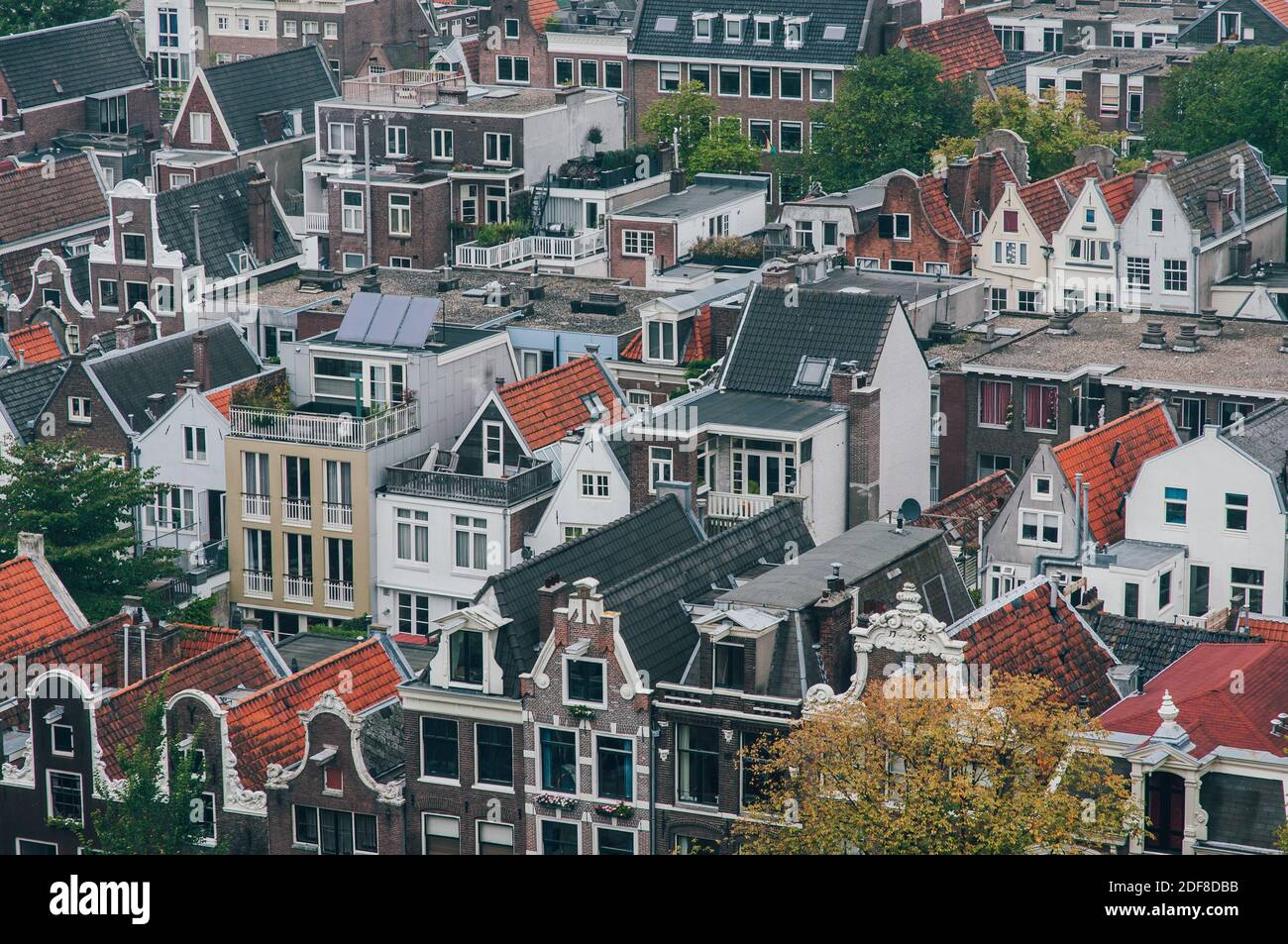 Typical Amsterdam houses and roofs in a fall day from above. close view ...