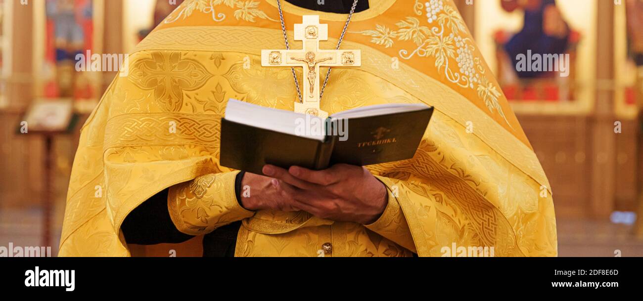 Orthodox Church. Christianity. Priest hands holding Holy Bible book in ...