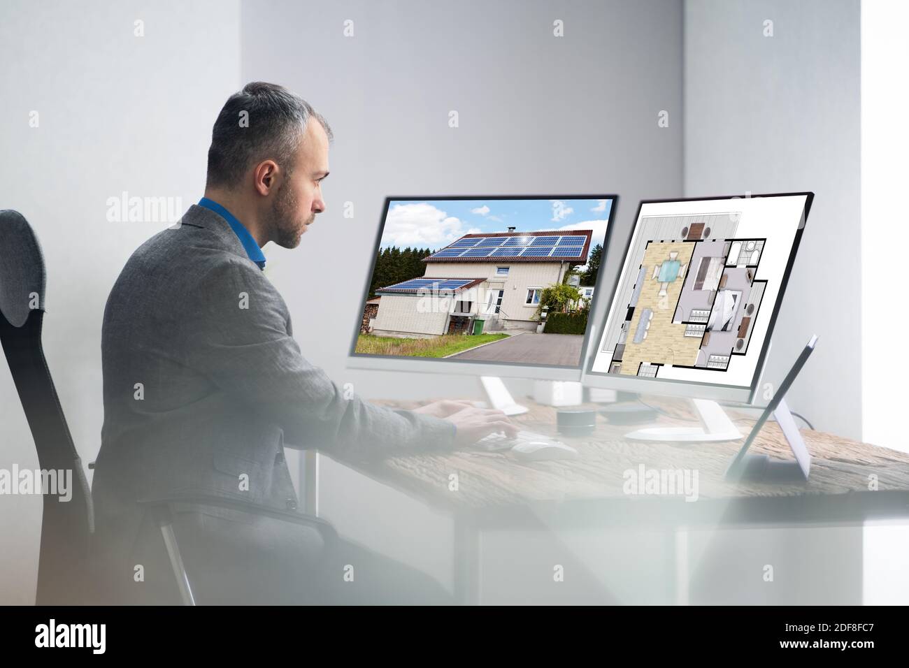 House Designer And Renovation Assessor Using Floor Plan Stock Photo - Alamy