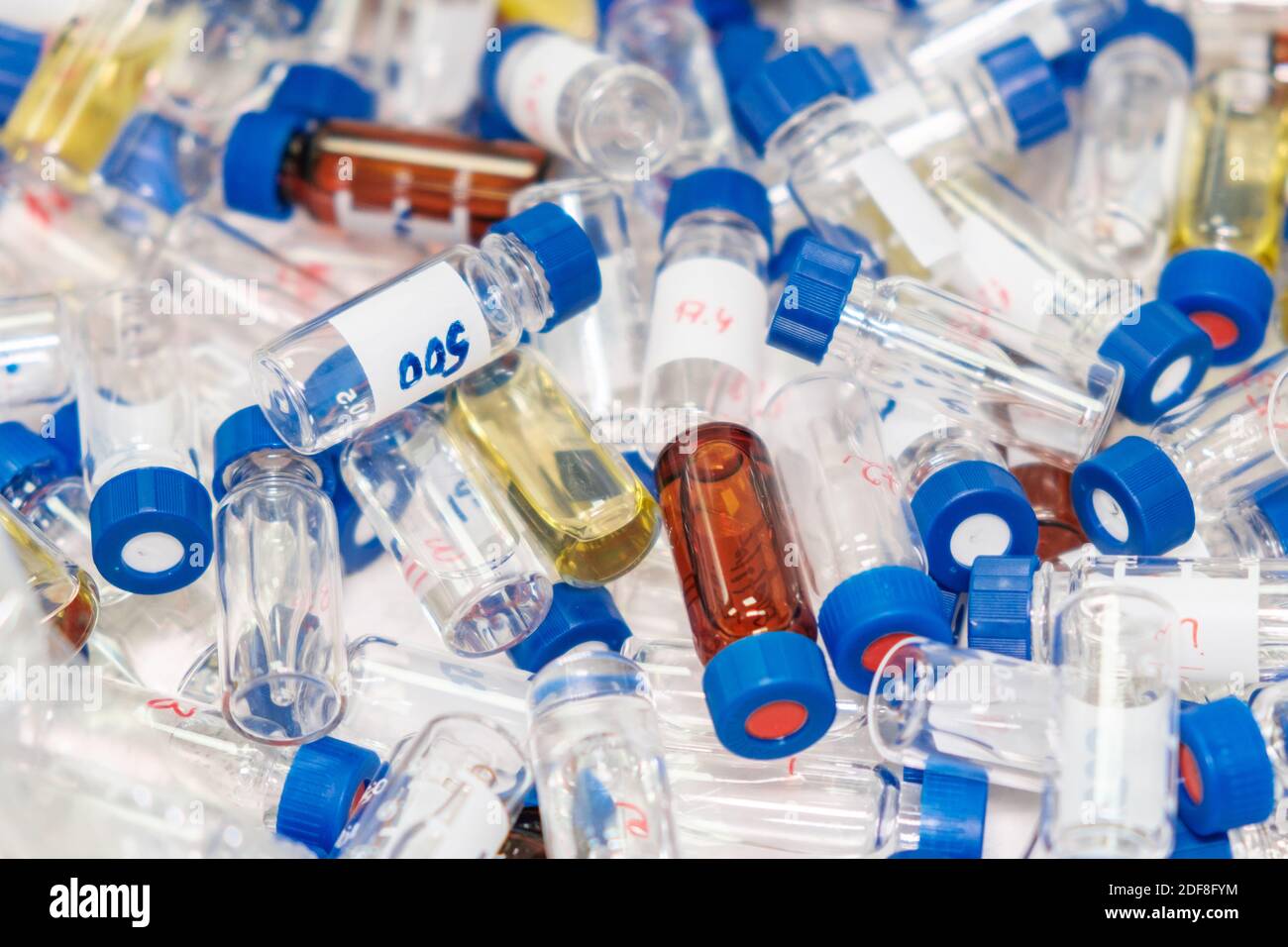 Dirty used chromatographic vials with blue caps. HPLC analysis at ...