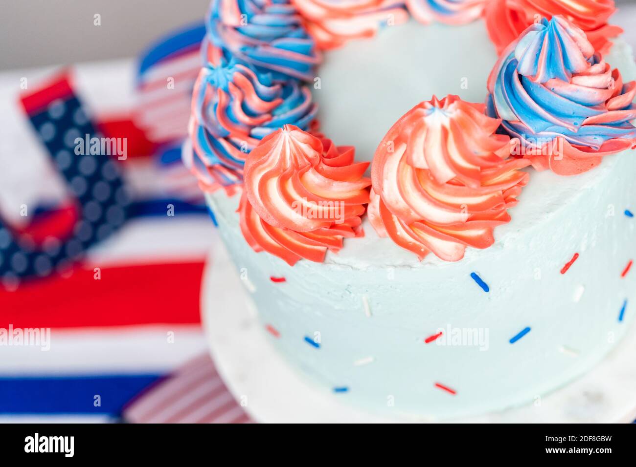 Red, white, and blue round vanilla cake with buttercream frosting for ...