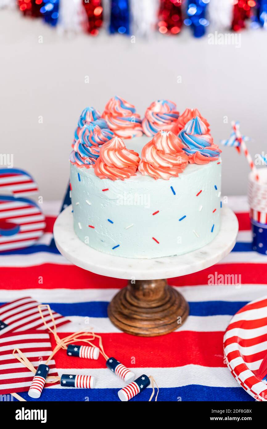 Red, white, and blue round vanilla cake with buttercream frosting for ...