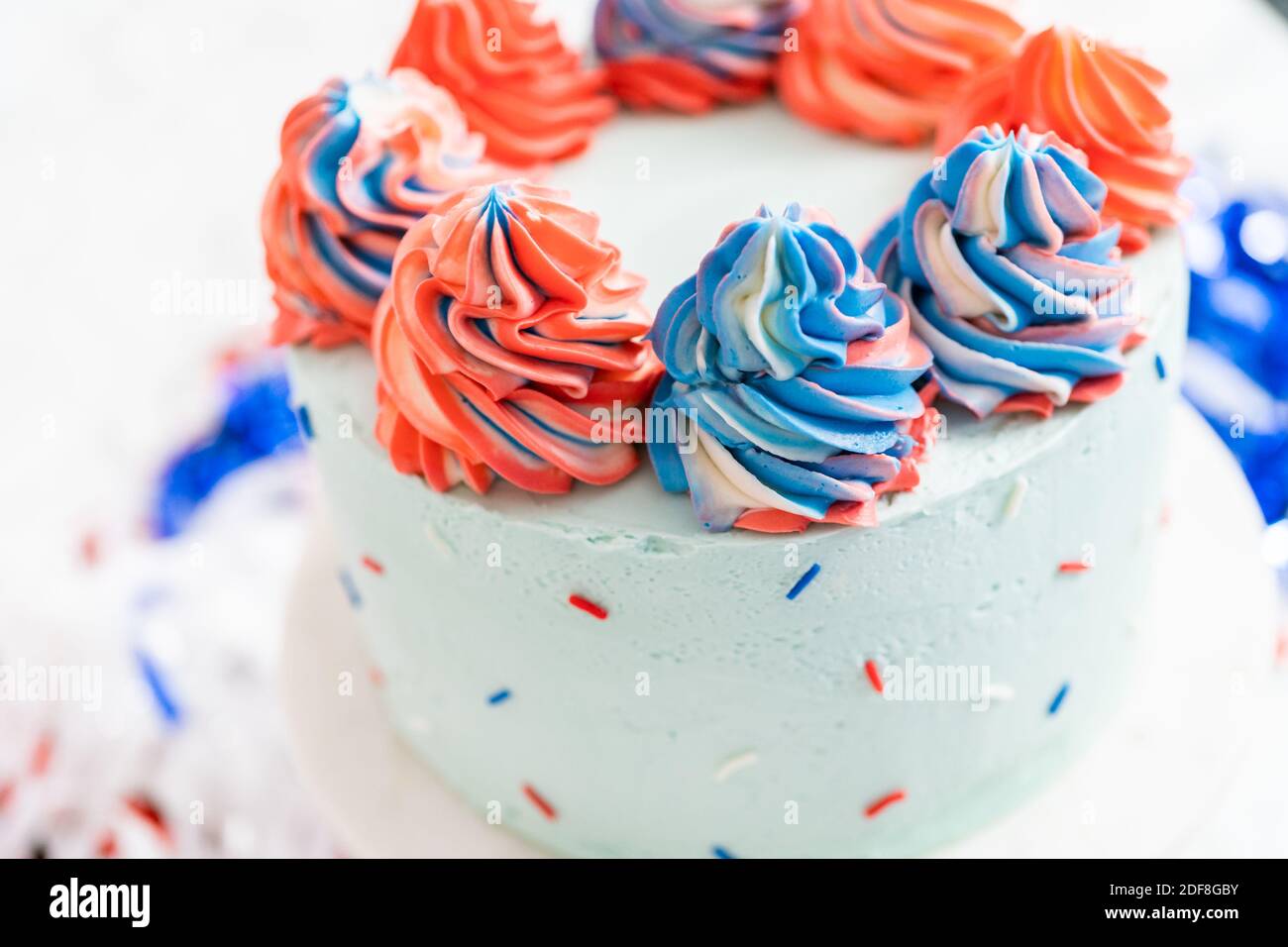 Red, white, and blue round vanilla cake with buttercream frosting for ...