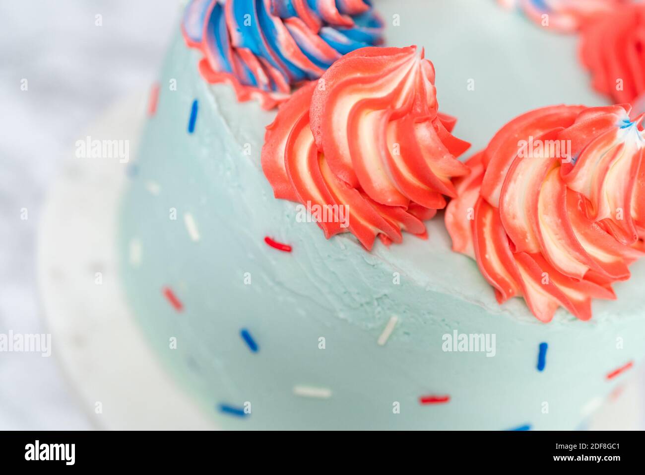 Red, white, and blue round vanilla cake with buttercream frosting for ...