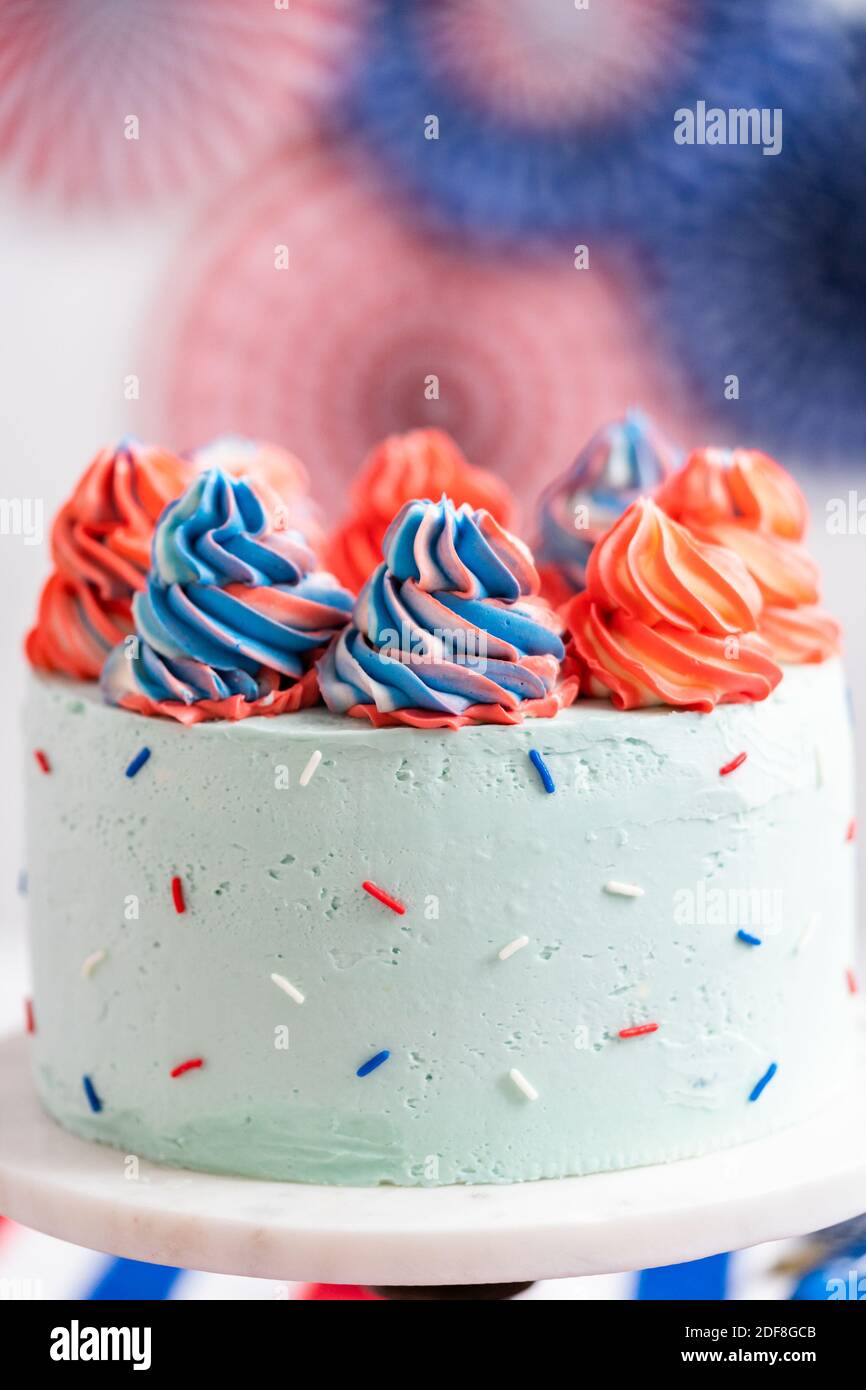 Red, white, and blue round vanilla cake with buttercream frosting for ...
