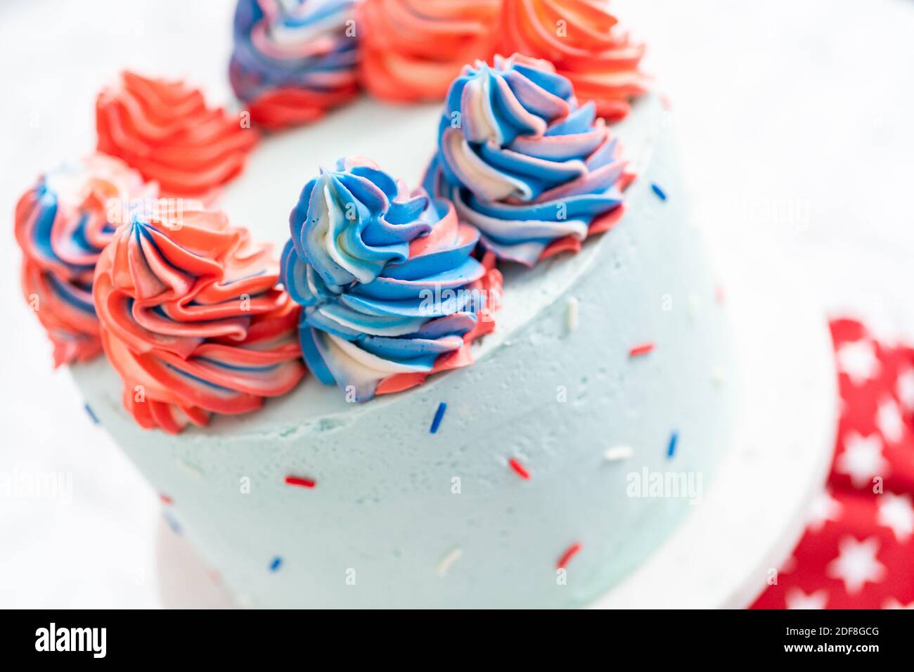 Red, white, and blue round vanilla cake with buttercream frosting for ...