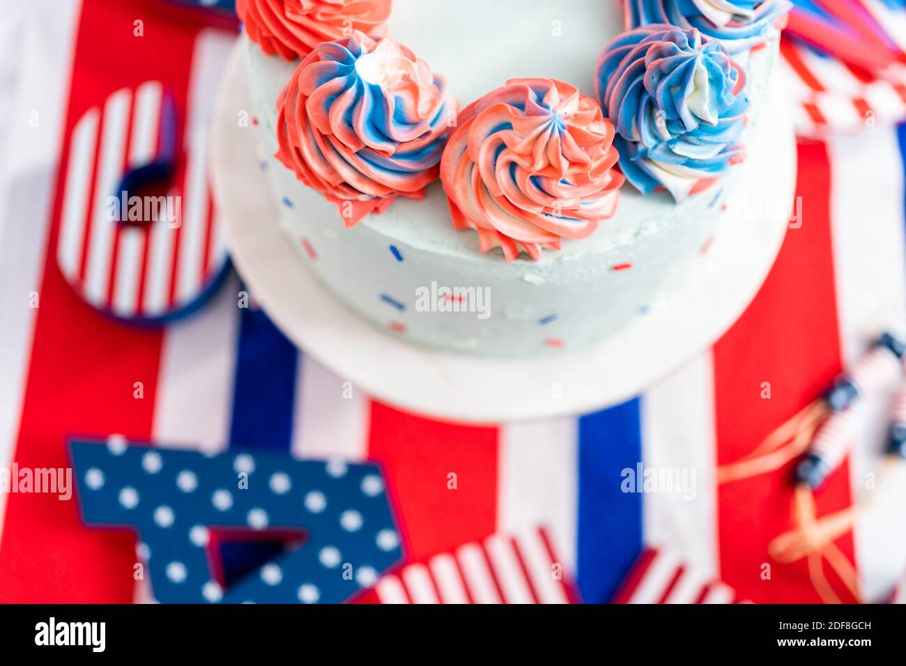 Red, white, and blue round vanilla cake with buttercream frosting for ...