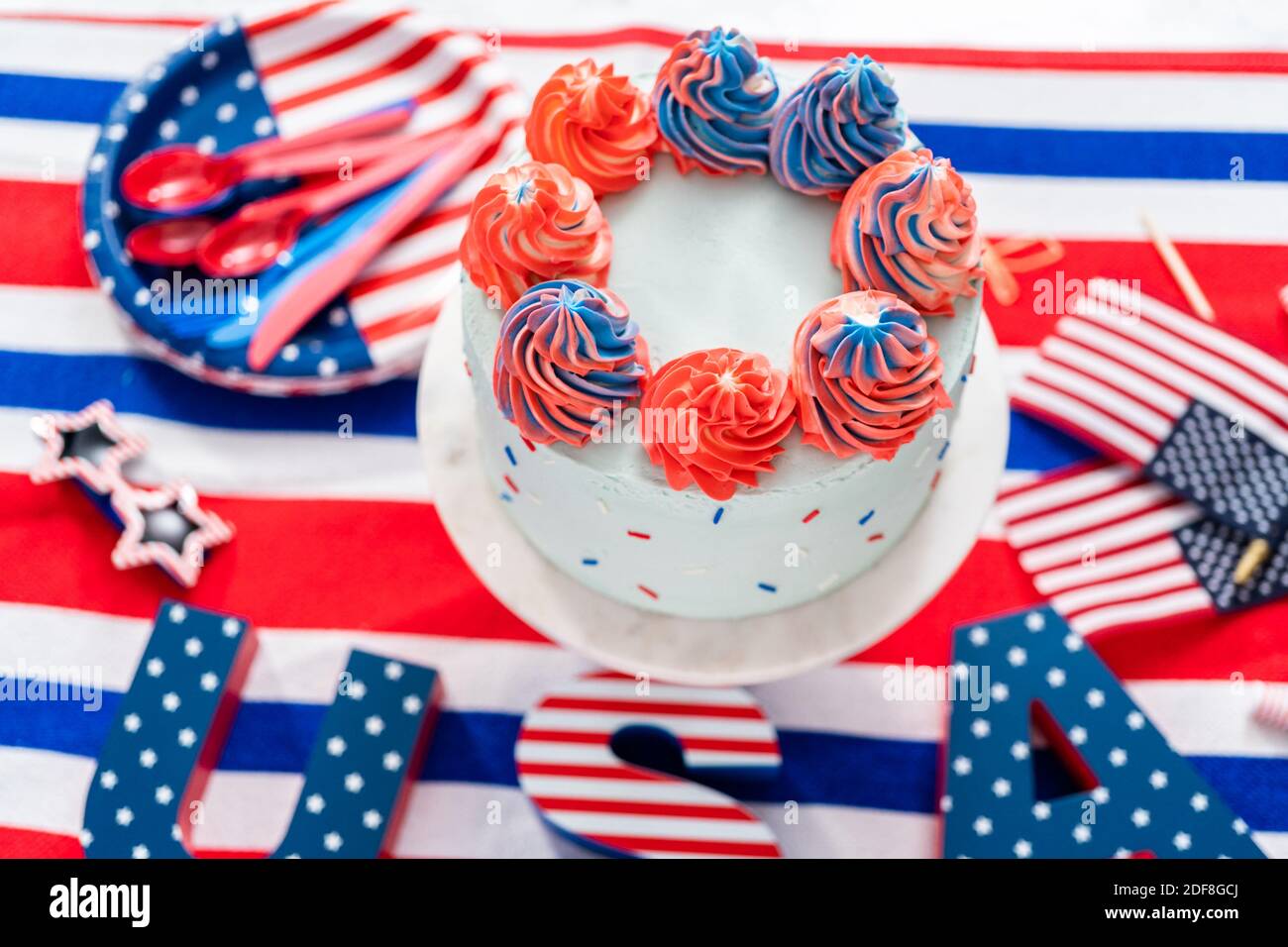 Red, white, and blue round vanilla cake with buttercream frosting for ...