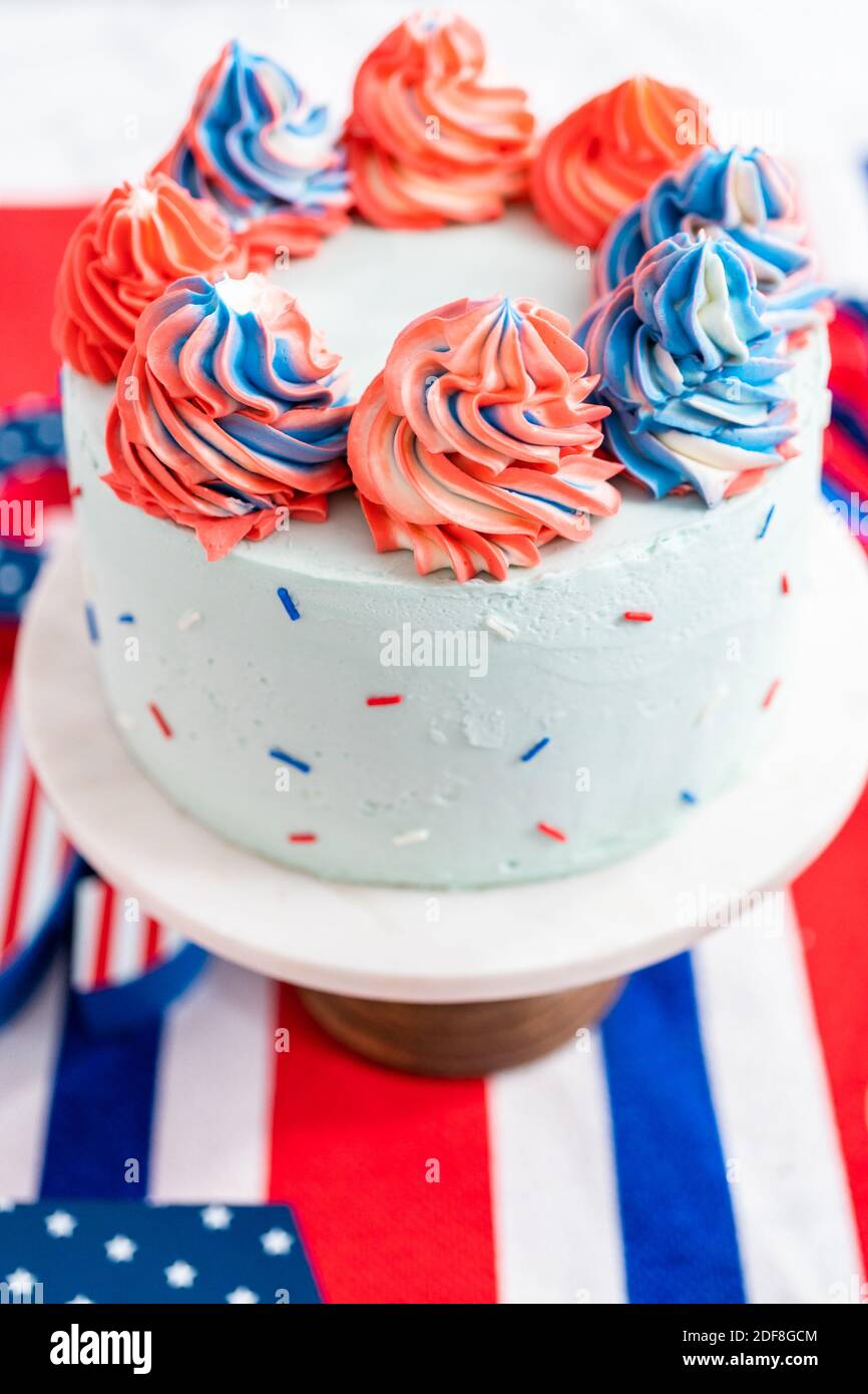 Red, white, and blue round vanilla cake with buttercream frosting for ...