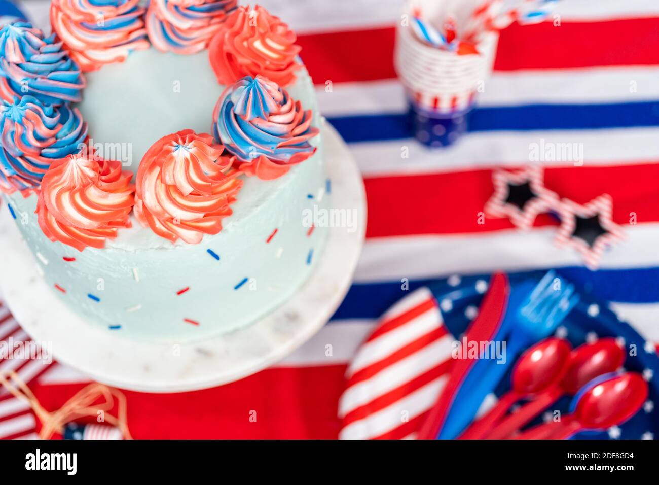 Red, white, and blue round vanilla cake with buttercream frosting for ...