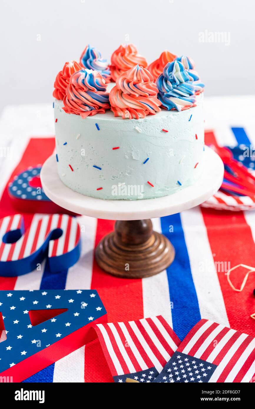 Red, white, and blue round vanilla cake with buttercream frosting for ...