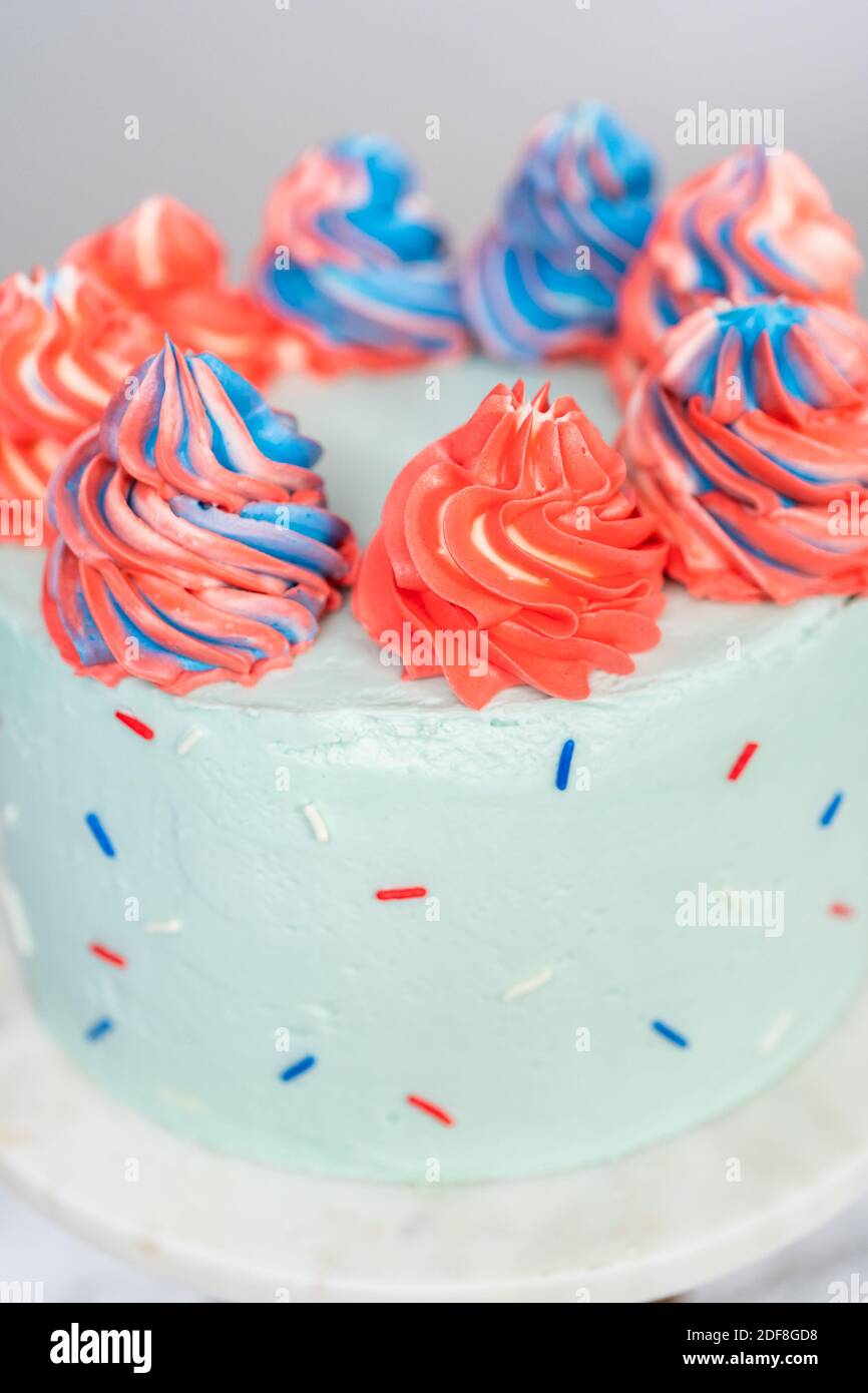 Red, white, and blue round vanilla cake with buttercream frosting for ...